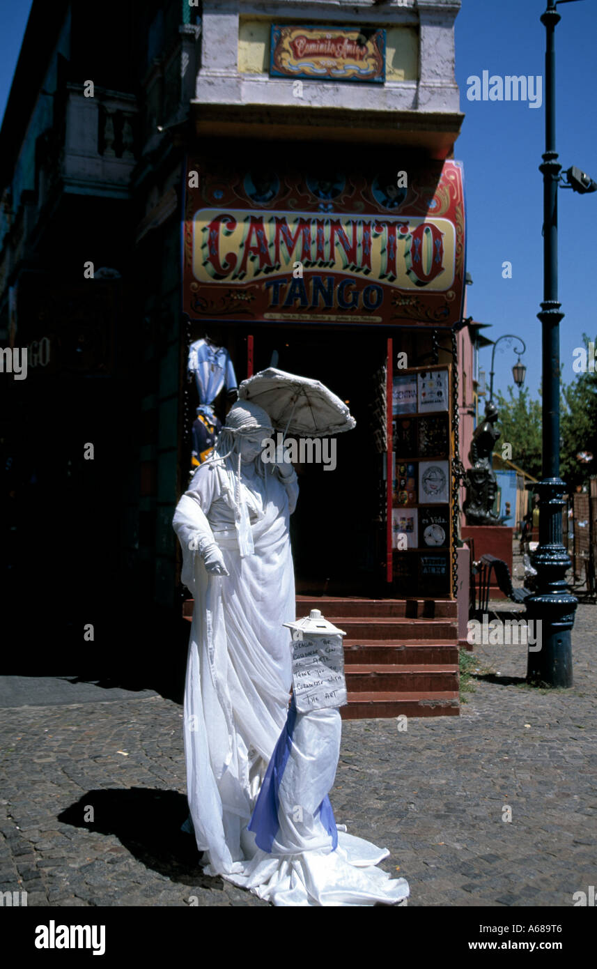 street entertainer dressed in white standing like a statue Stock Photo ...