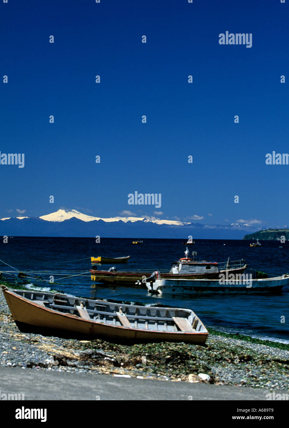 fishing boats beached with the andes mountains in the background Stock ...
