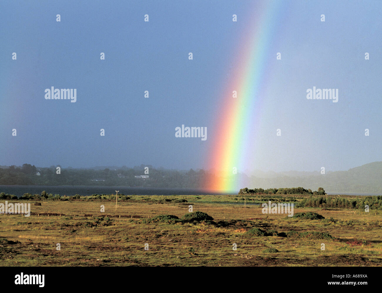 colorful rainbow rising out of the landscape Stock Photo - Alamy