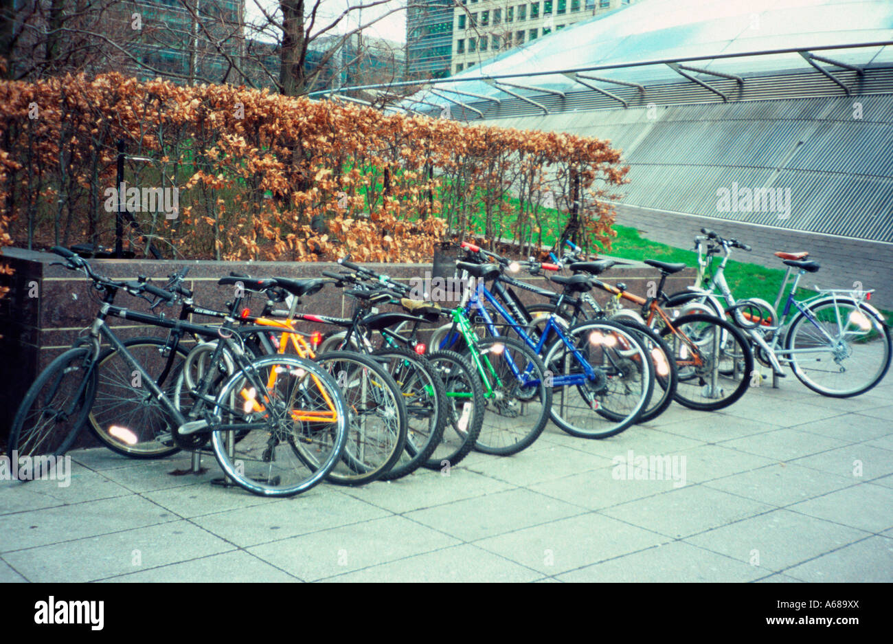 Cycles stacked outside Canary Wharf underground station, London, UK ...