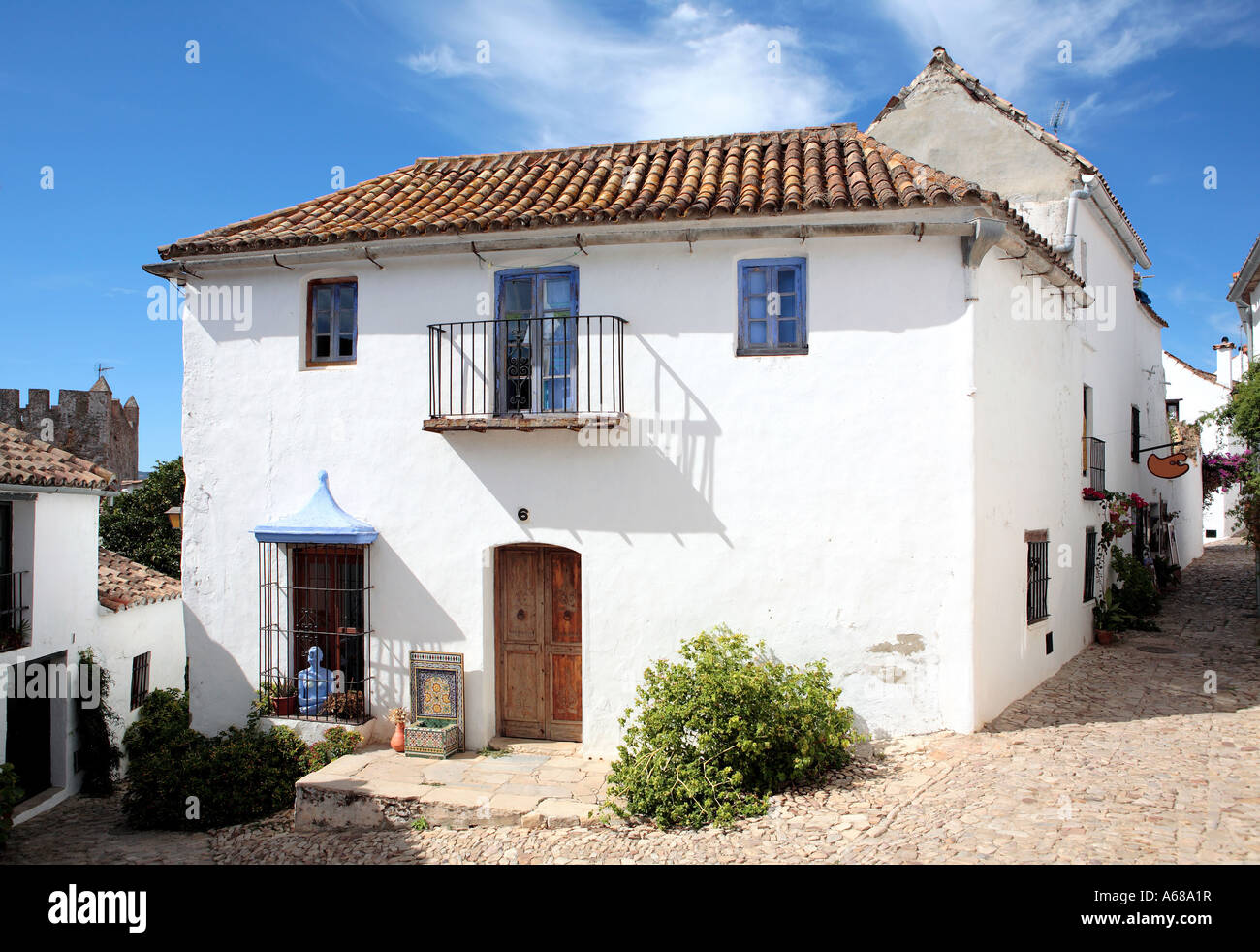 Narrow cobbled streets and pretty houses of Spanish Pueblo at Castillo ...