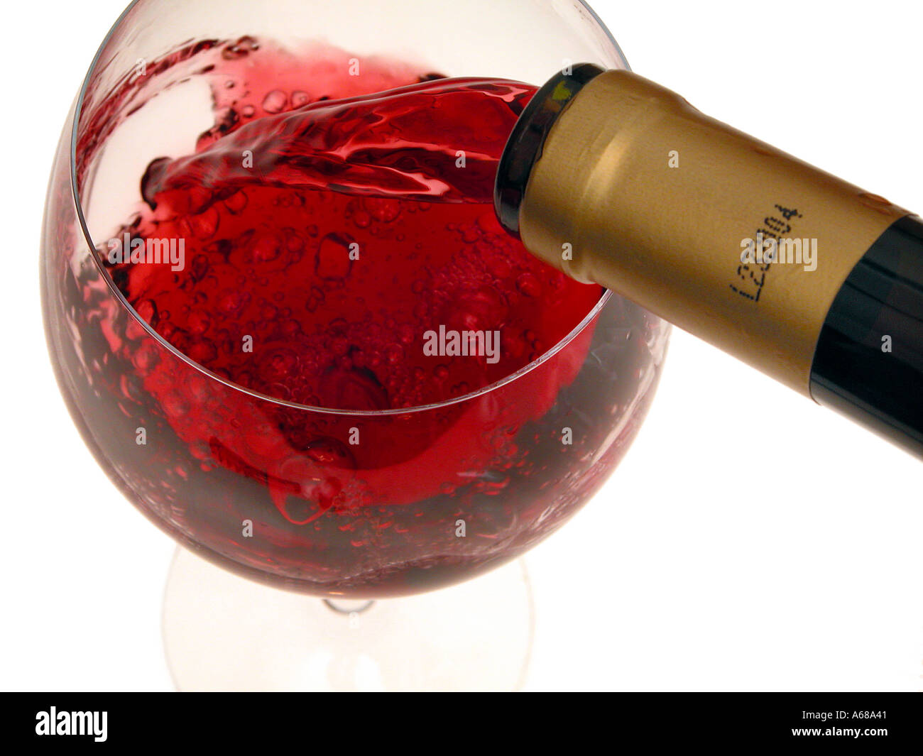 Pouring red wine into glass CUT out cutout Stock Photo - Alamy