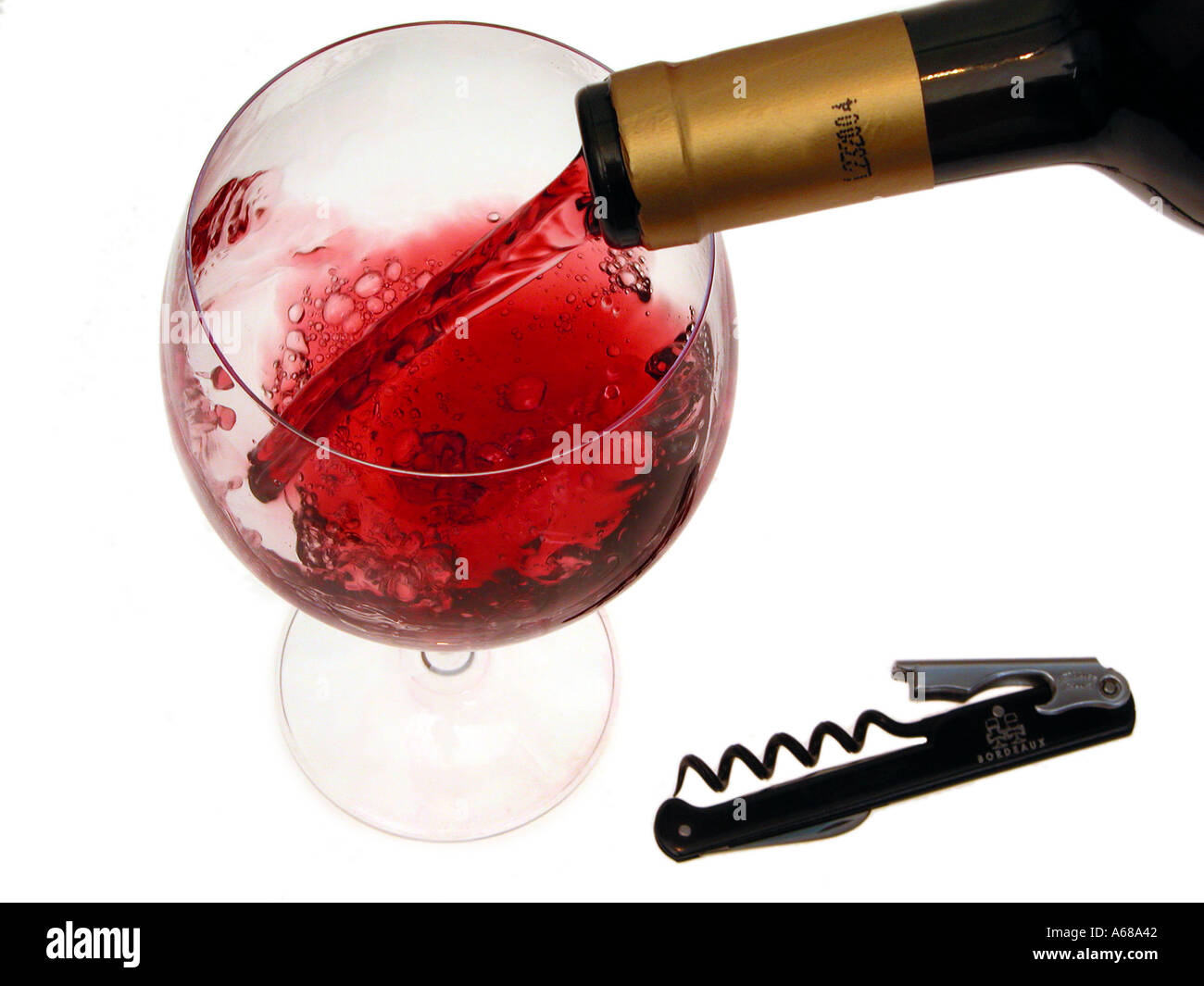 Pouring red wine into glass CUT out cutout Stock Photo - Alamy