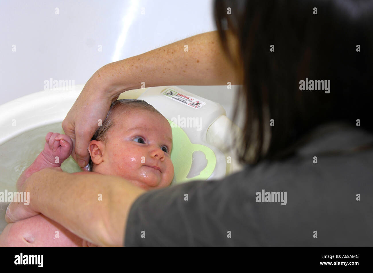 mother bathing baby portrait face horizontal close up detail bath bath ...