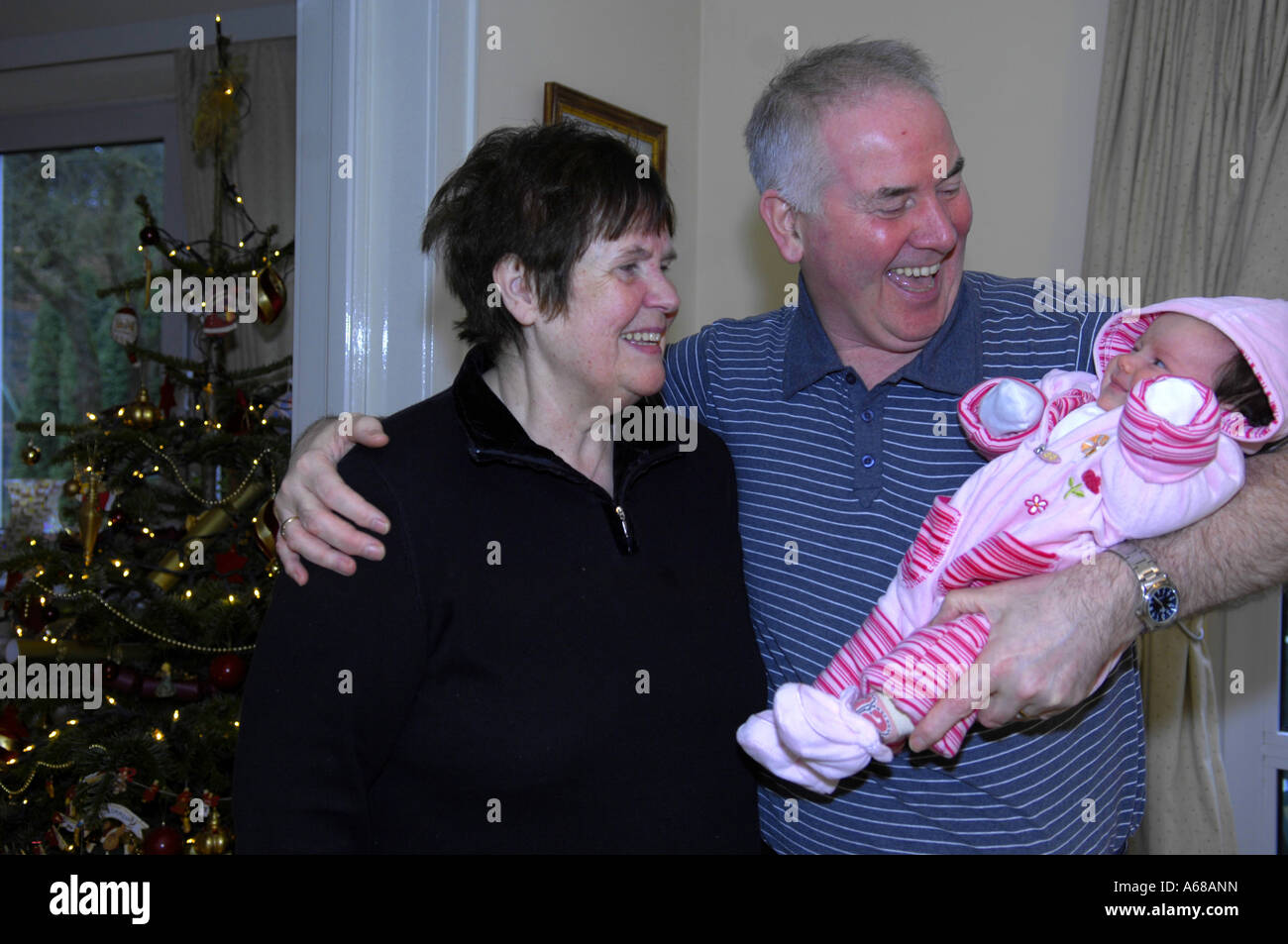 proud grandparents happy smiling positive baby caucasian two months old ...