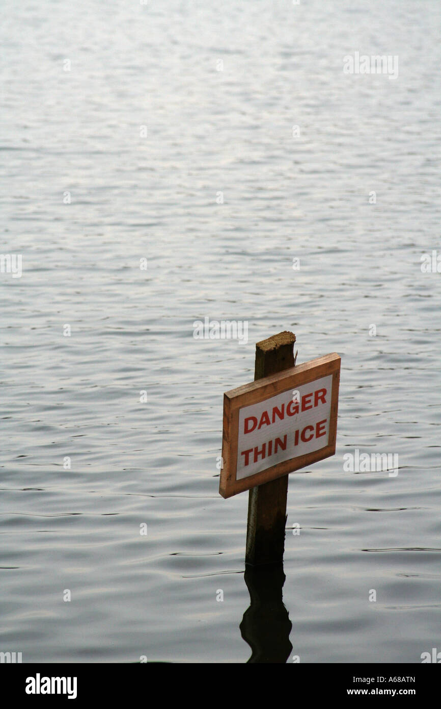 Danger Thin Ice sign on lake Stock Photo - Alamy