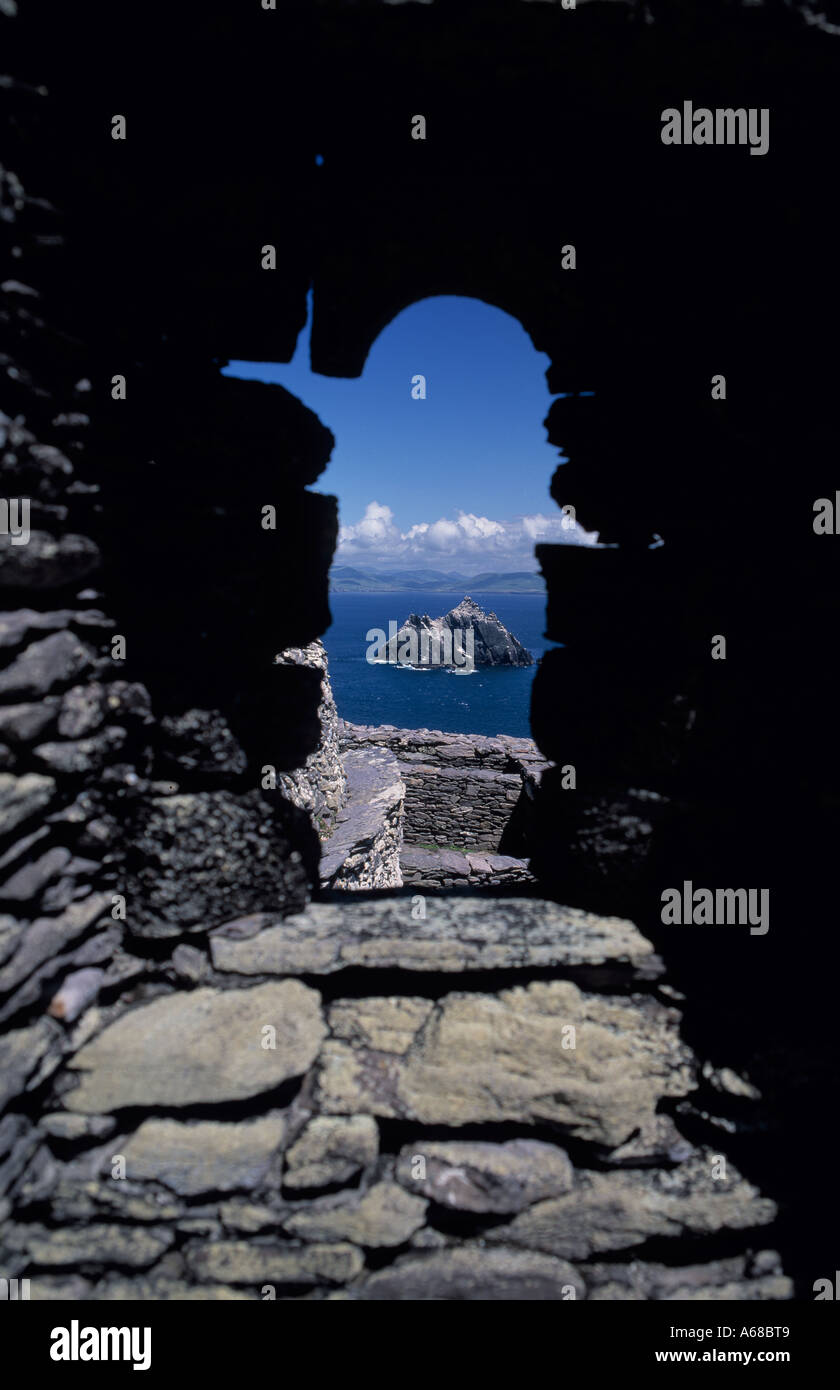 window in historical church looking onto little skellig island, irish ...