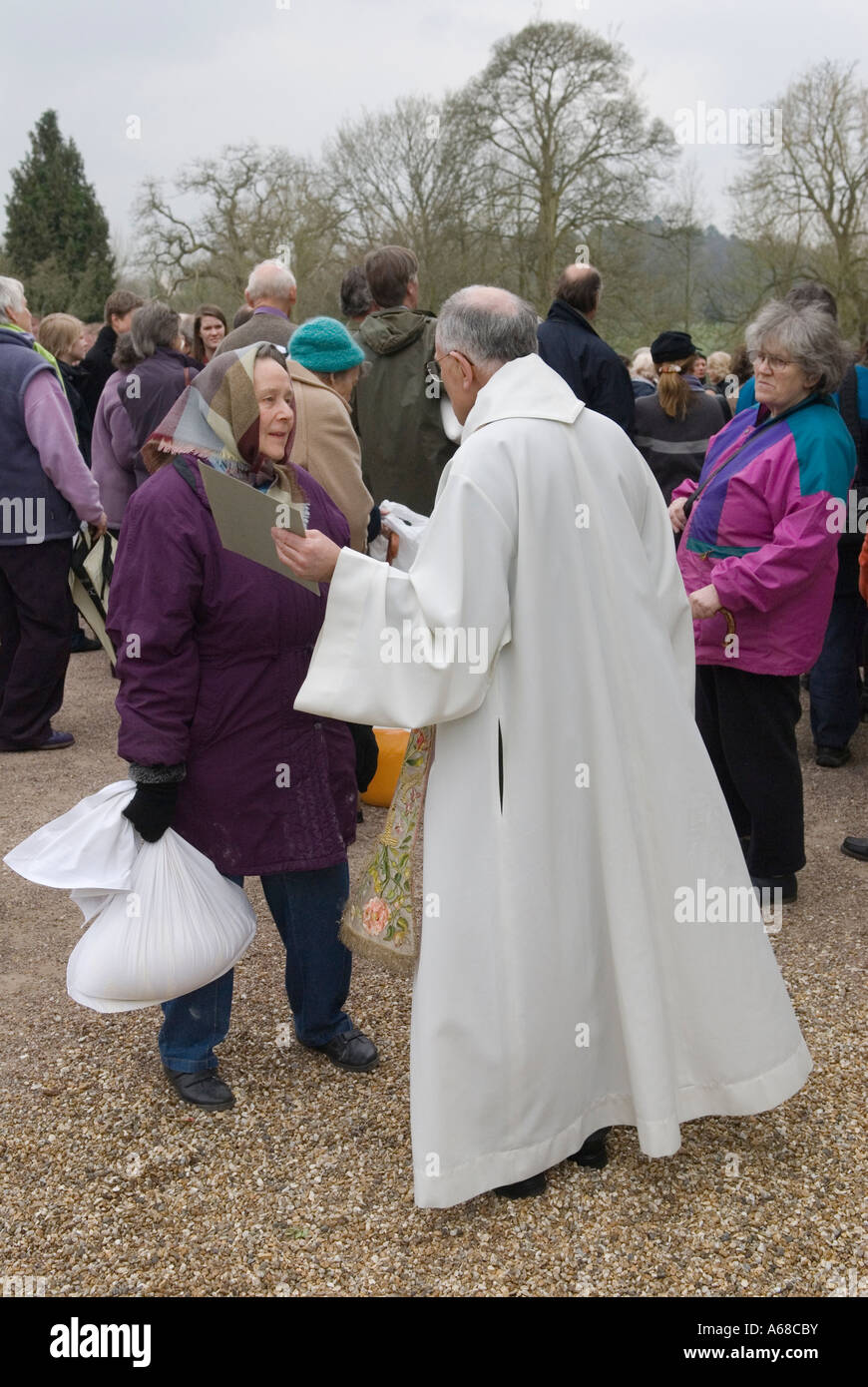 Roman Catholic priest talking to parishioner at Tichborne Dole ...