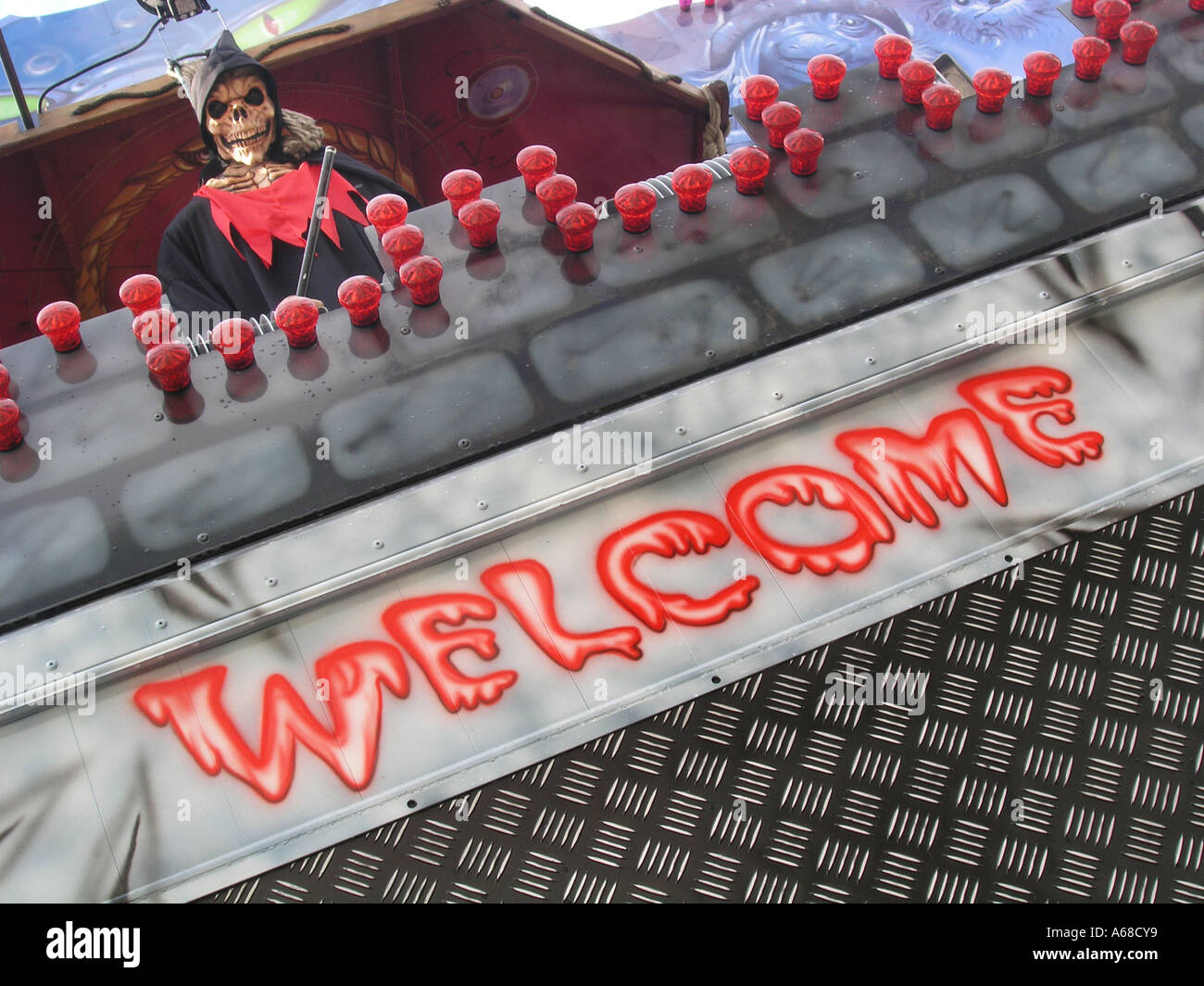 welcome sign at fairground with creepy skeleton in background Stock ...