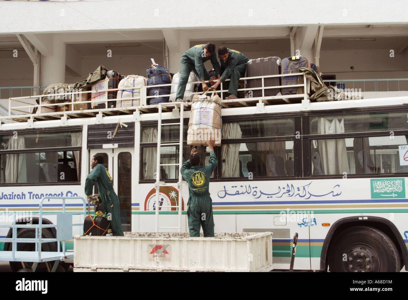 Workers handling pilgrims luggage in Jeddah, Saudi Arabia Stock Photo ...