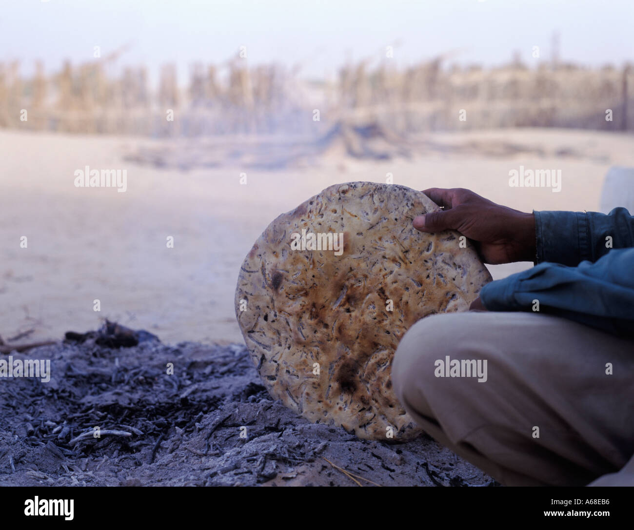 Baking breakfast bread in sahara Stock Photo - Alamy