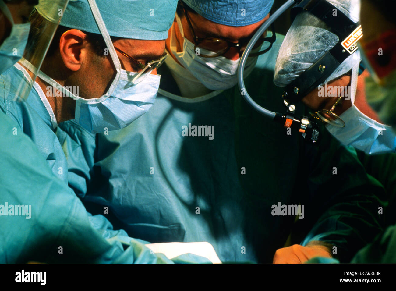 Surgeons performing a surgical procedure Stock Photo - Alamy
