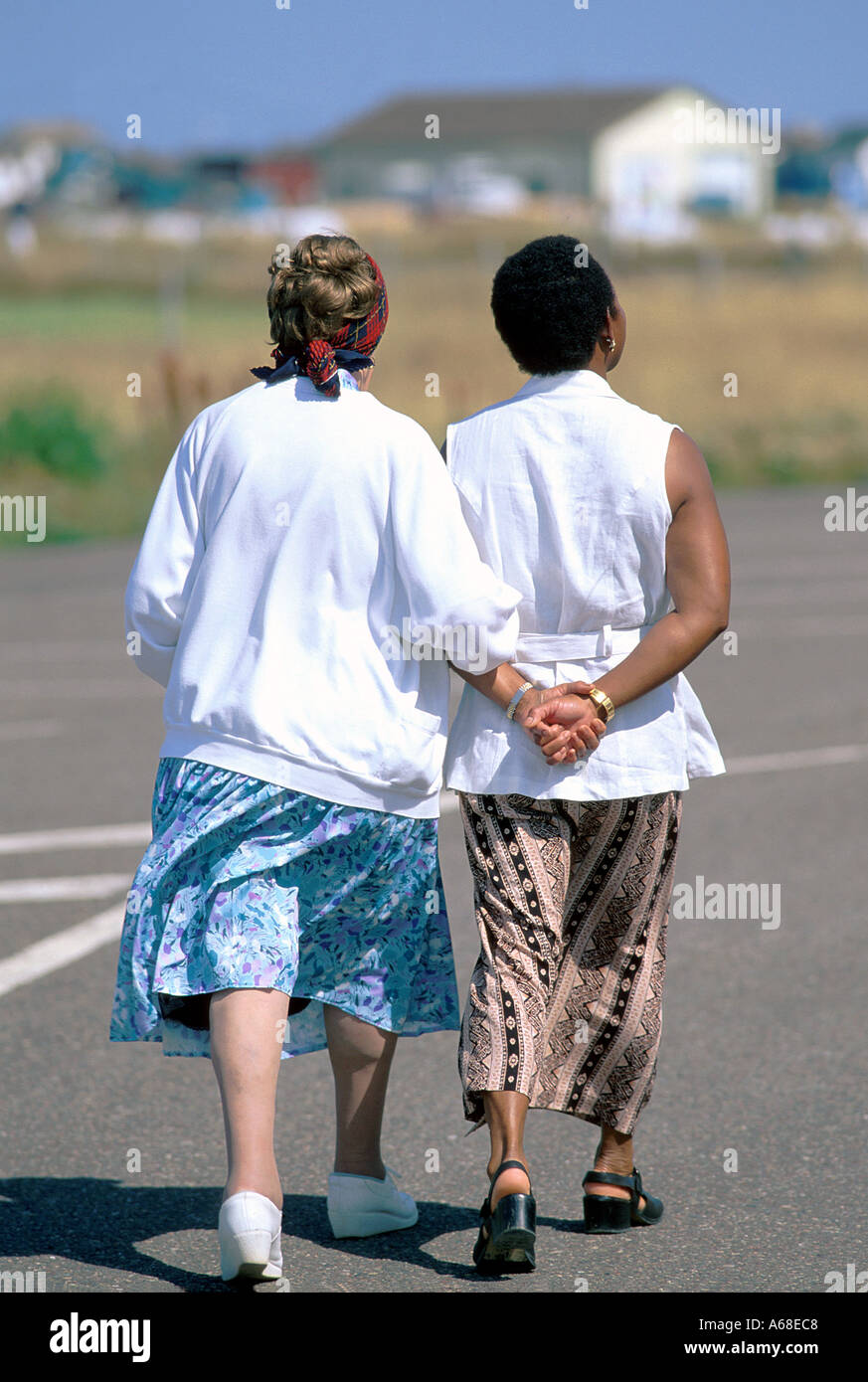 Women walk arm in arm on Miquelon Island Stock Photo - Alamy