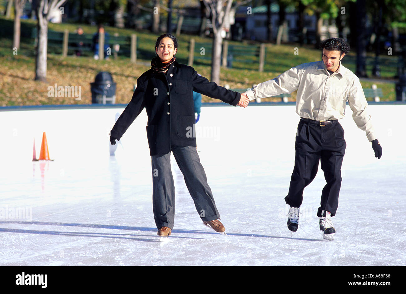 Couple holding hands on ice hi-res stock photography and images - Alamy