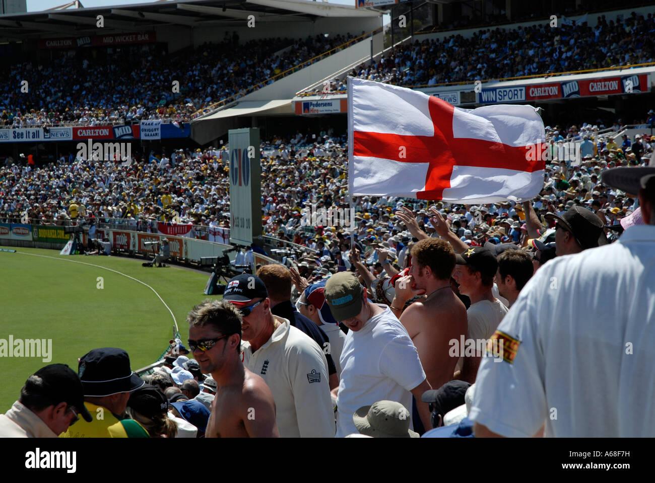 Members of the Barmy Army at Ashes Test Match, flying the English flag ...