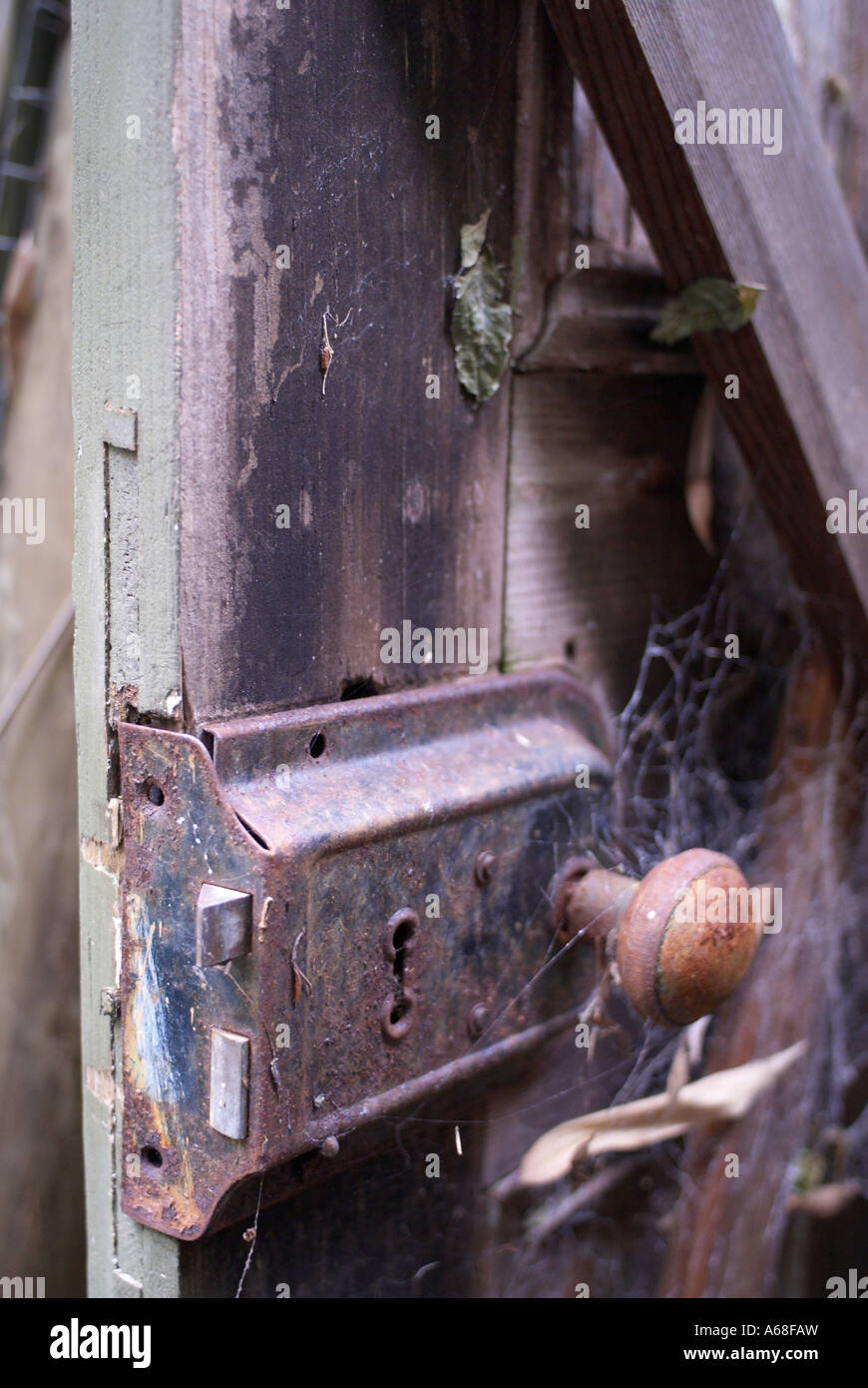 Old wooden door, handle and lock assembly Stock Photo - Alamy