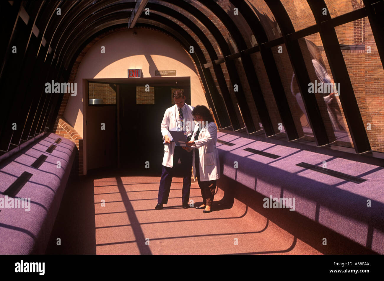 Doctors consult in a hospital hallway Stock Photo - Alamy