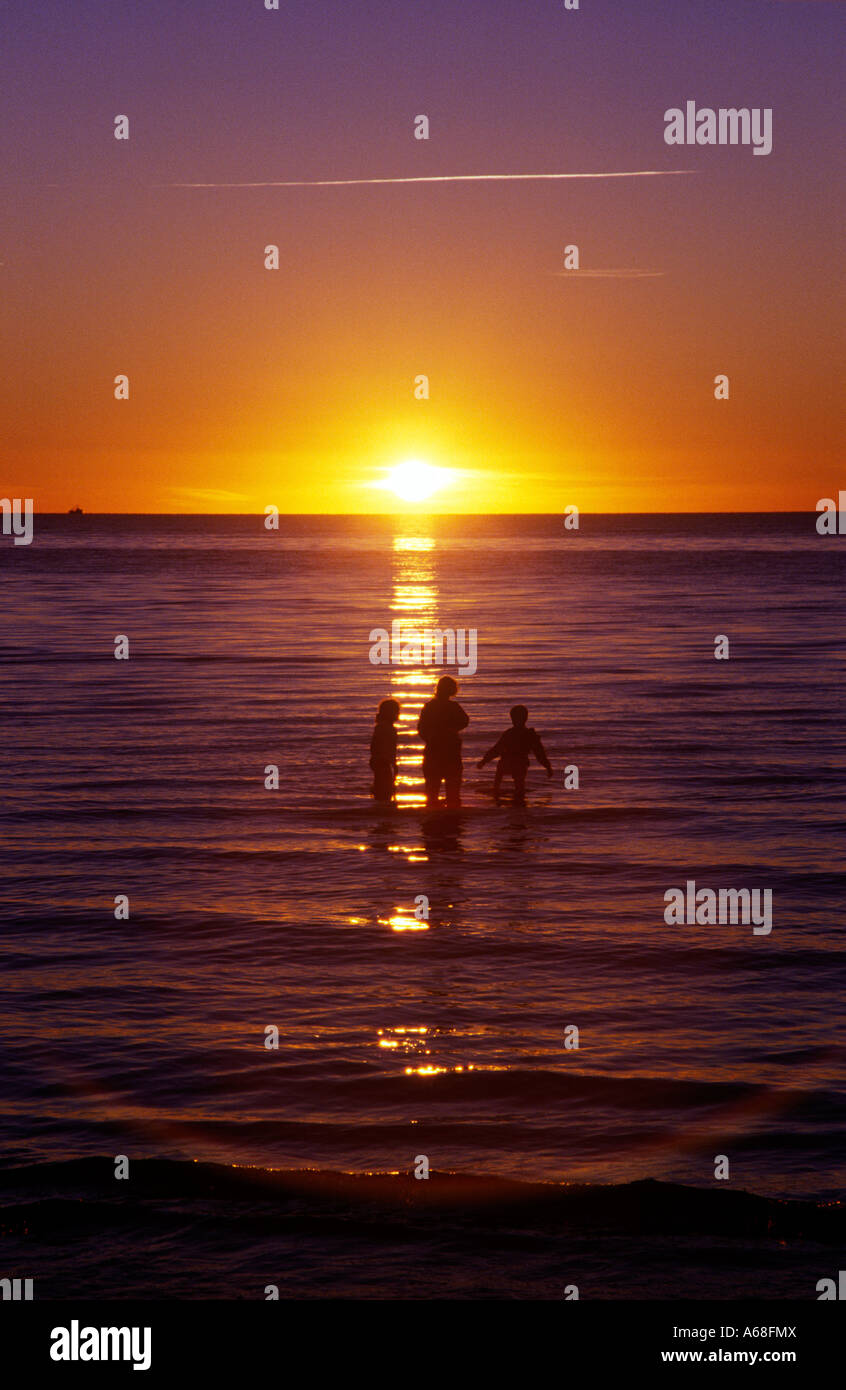 Wading in the ocean water at sunset Rock Harbor Cape Cod MA Stock Photo ...