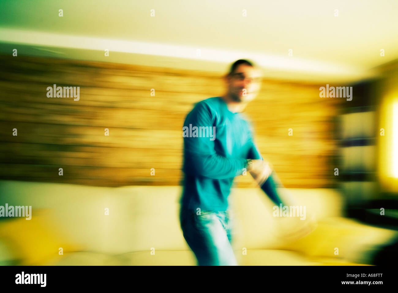 Man figure in movement indoors Stock Photo - Alamy