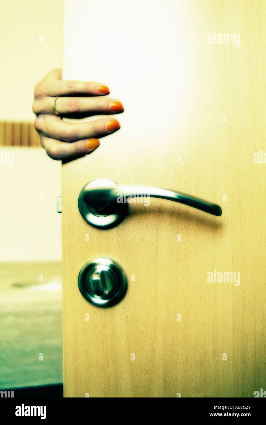 Hand opening a door Stock Photo - Alamy