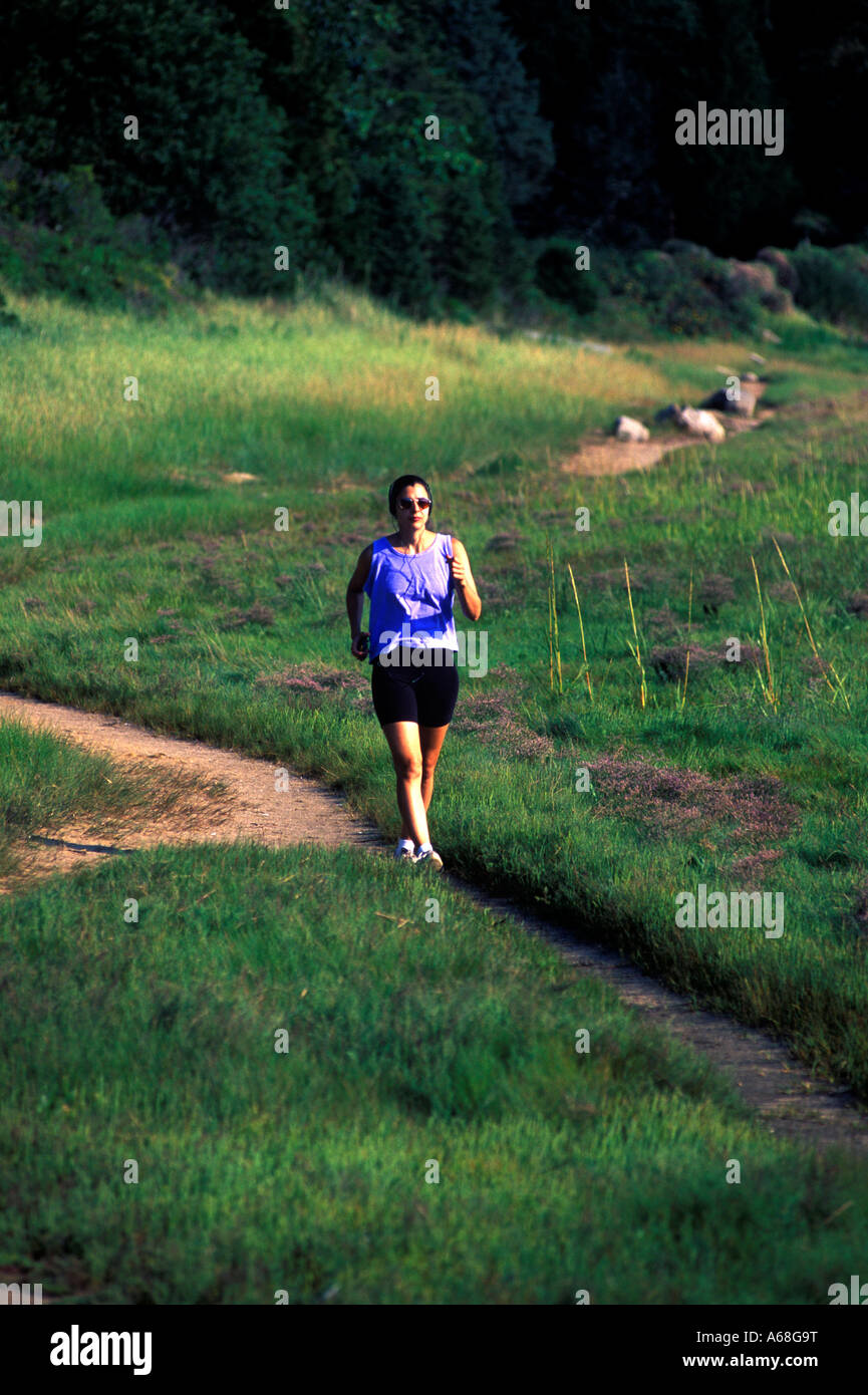 Woman power walking on path Stock Photo - Alamy