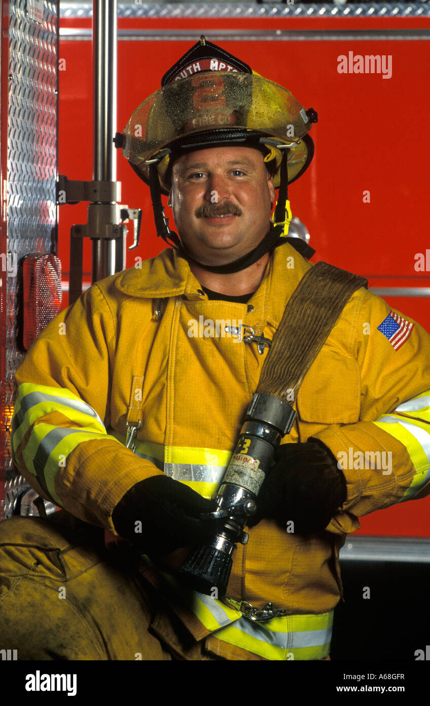 Fireman with fire hose Stock Photo - Alamy