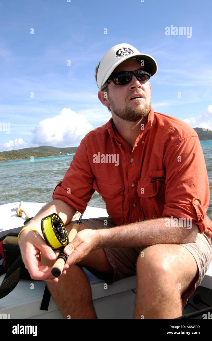 British Virgin Islands Caribbean Man holding rod looks out over the ...