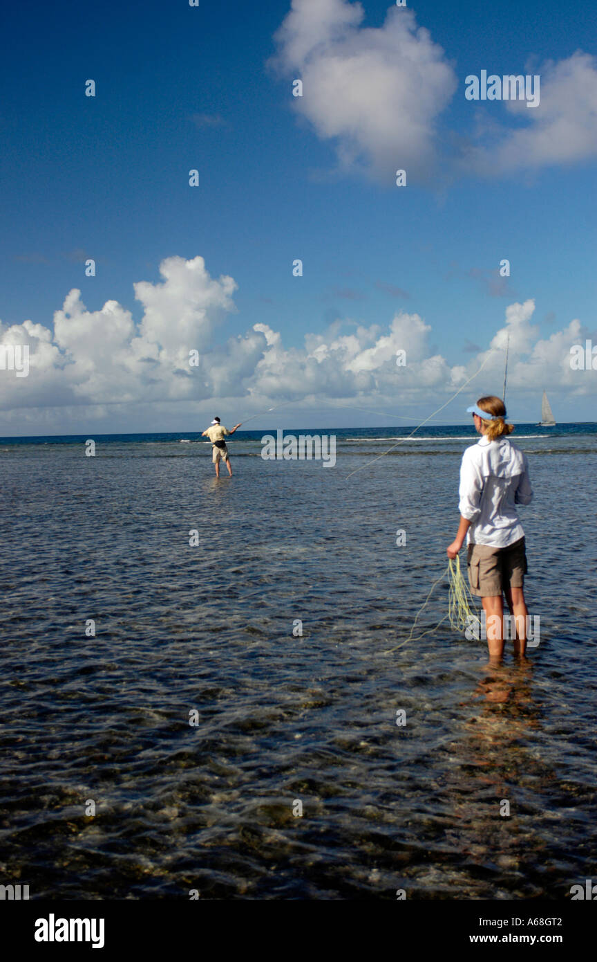 British Virgin Islands Caribbean Couple salt water fly fishing for bone ...