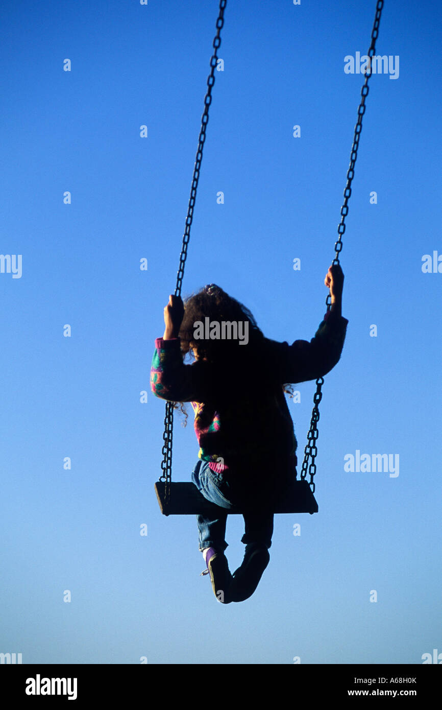 Girl on swing Stock Photo - Alamy