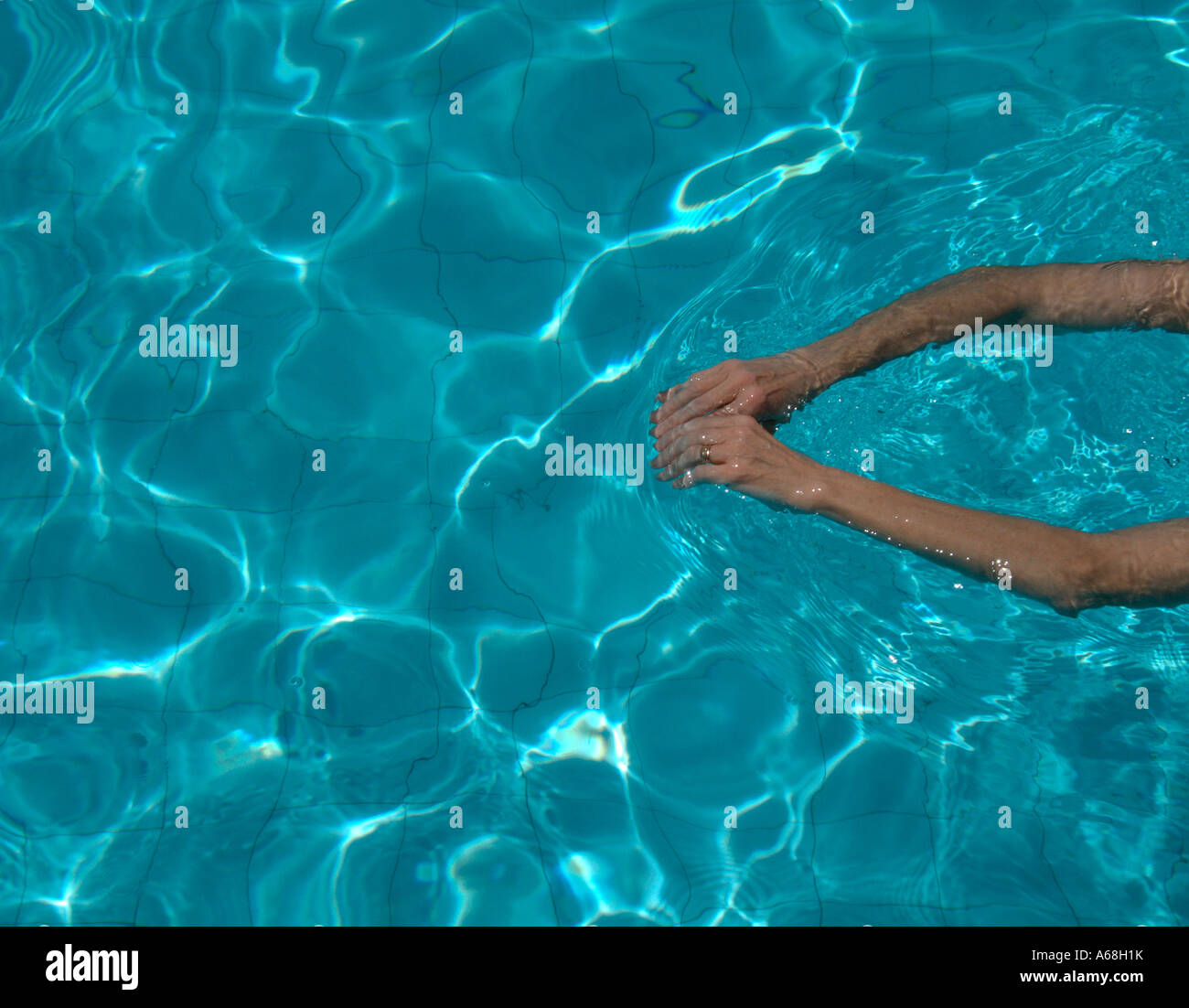 Senior woman working out in a swimming pool Stock Photo - Alamy