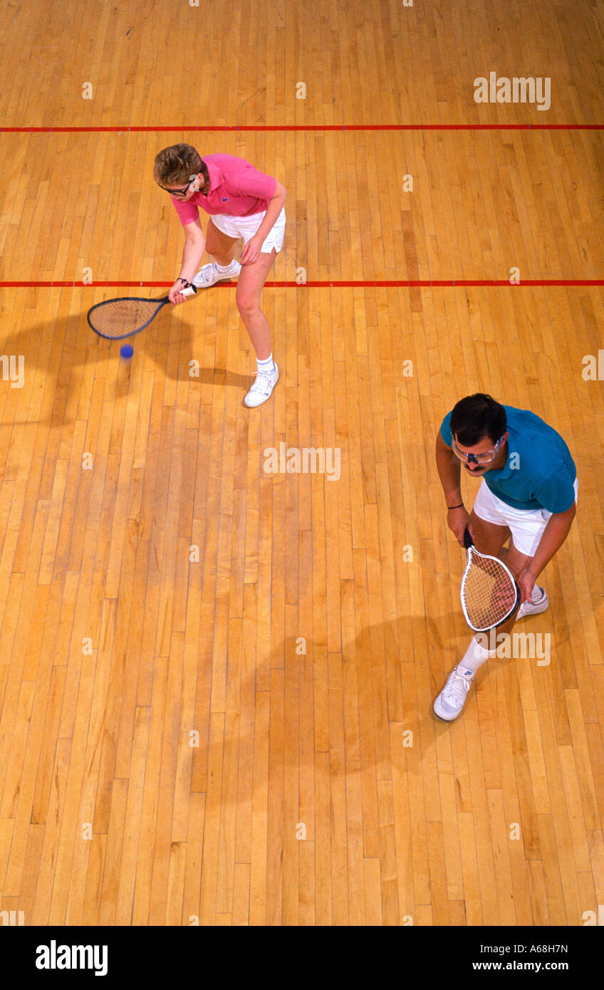Man and women playing racquetball Stock Photo - Alamy