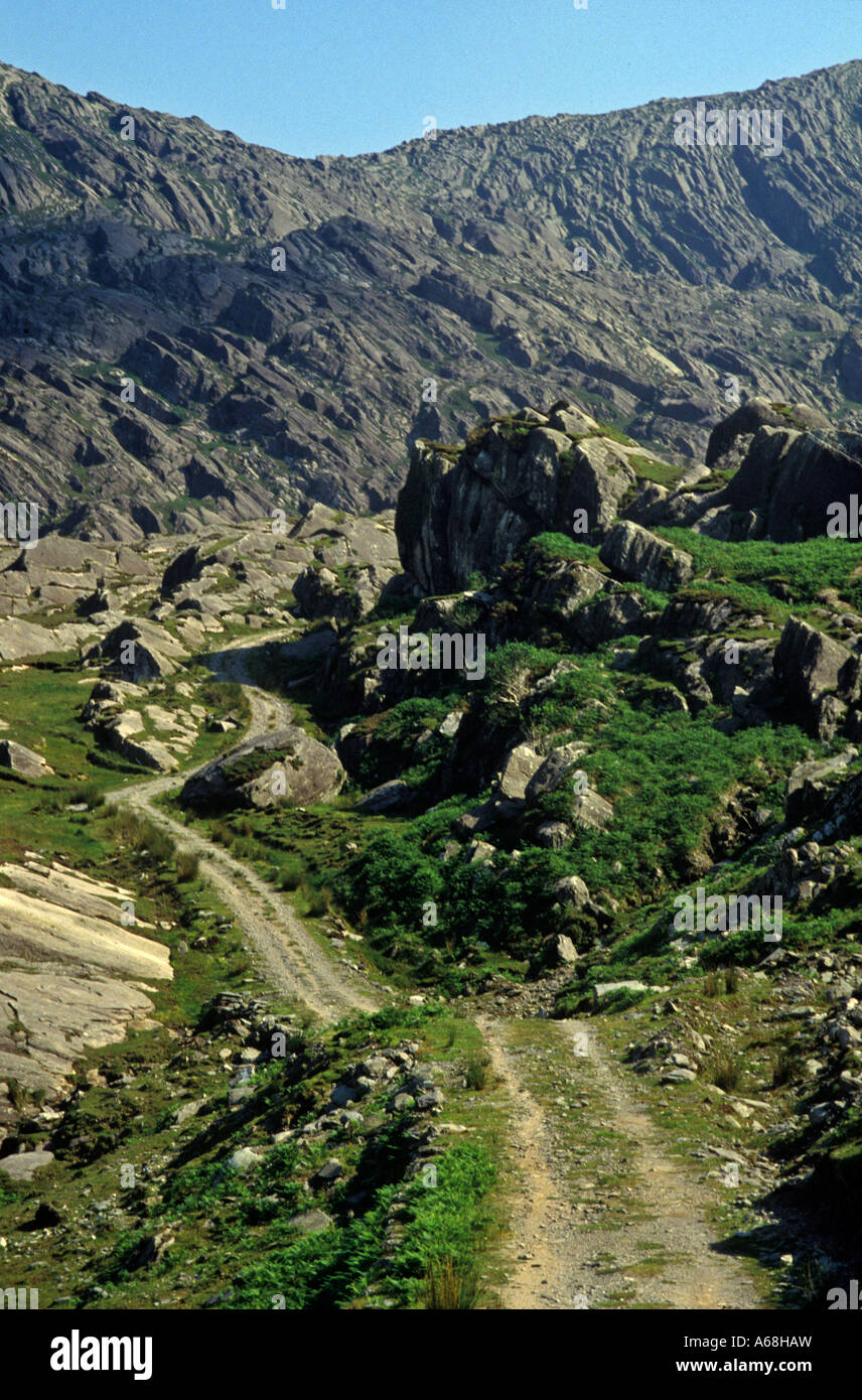Narrow dirt road through the rocky karstic limestone Burren mountains ...