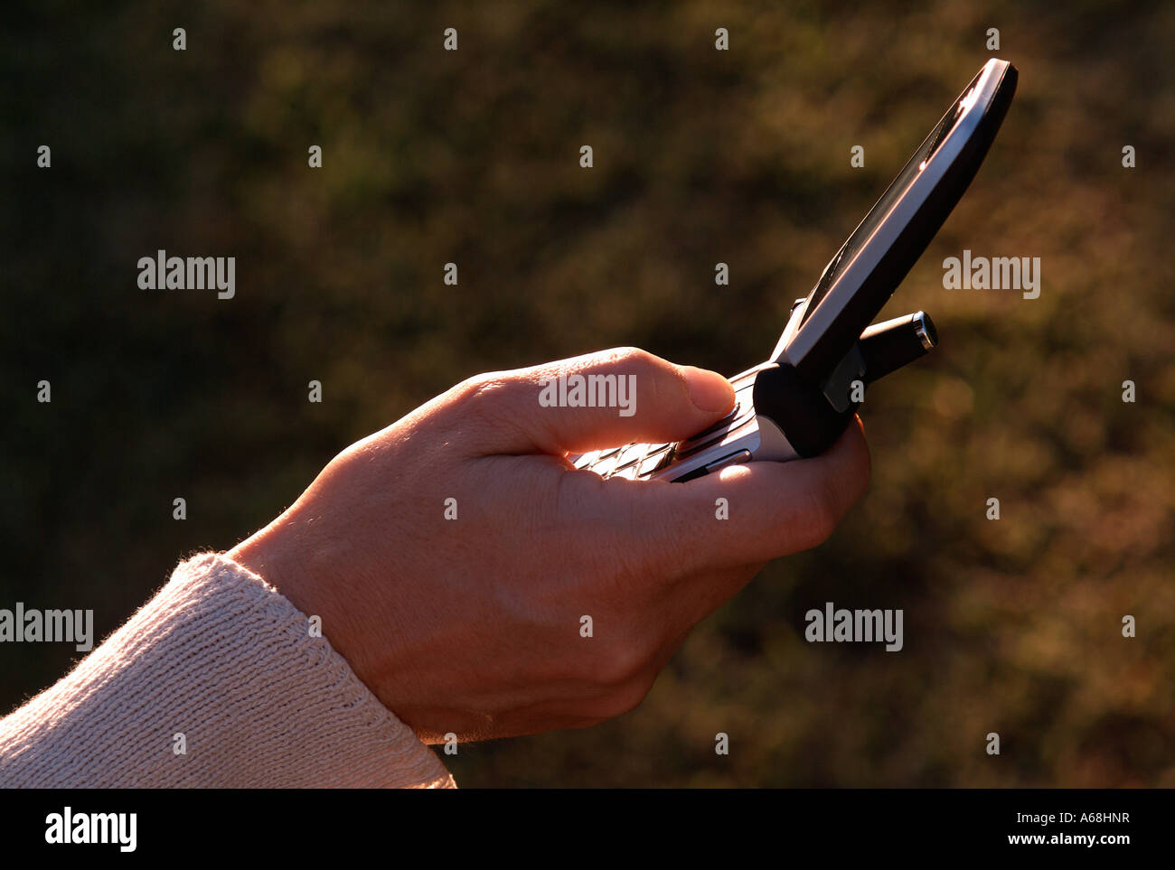 Close up of a hand using a mobile phone Stock Photo - Alamy