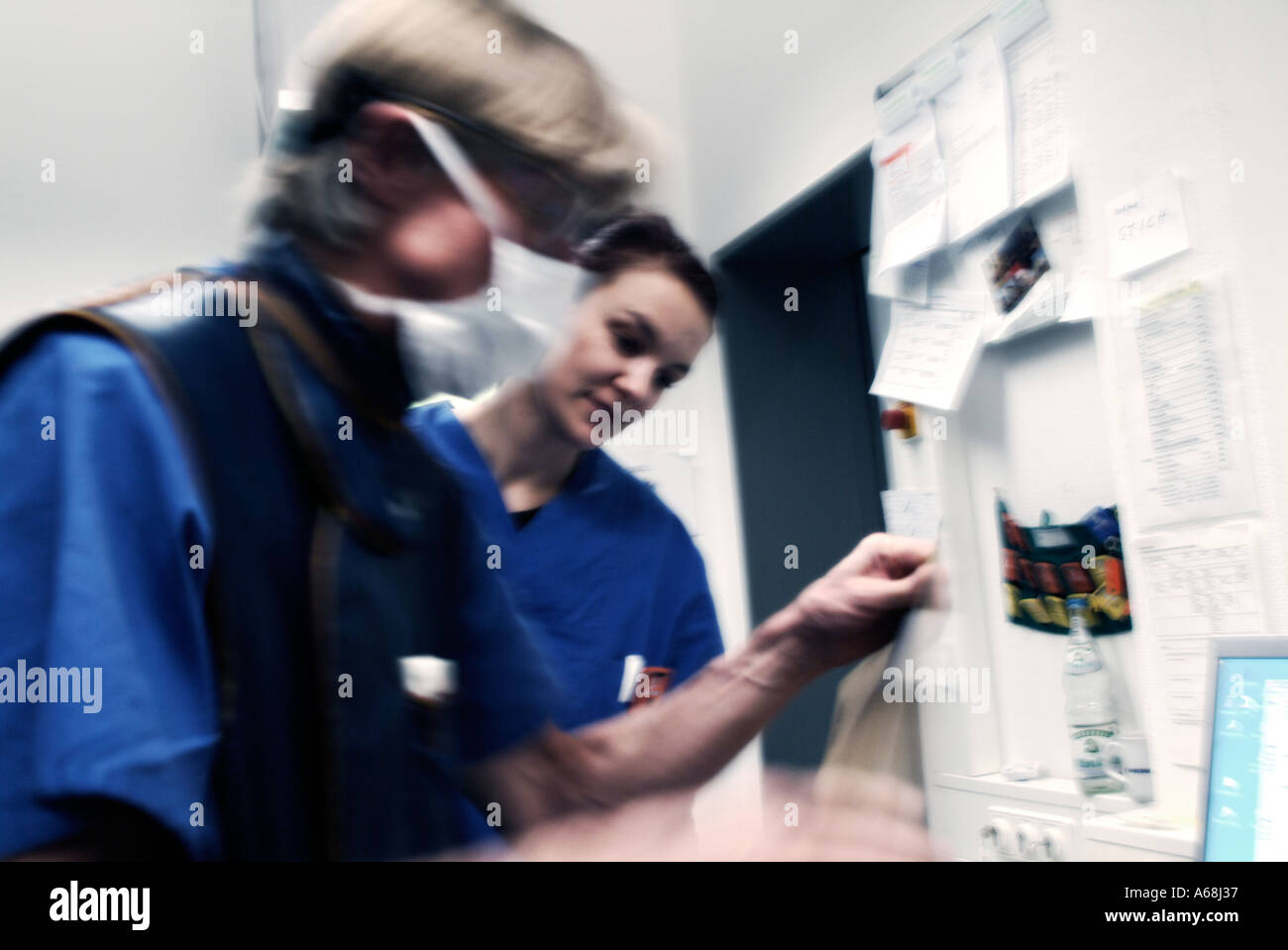 Nurse assisting a surgeaon prior surgery Stock Photo - Alamy