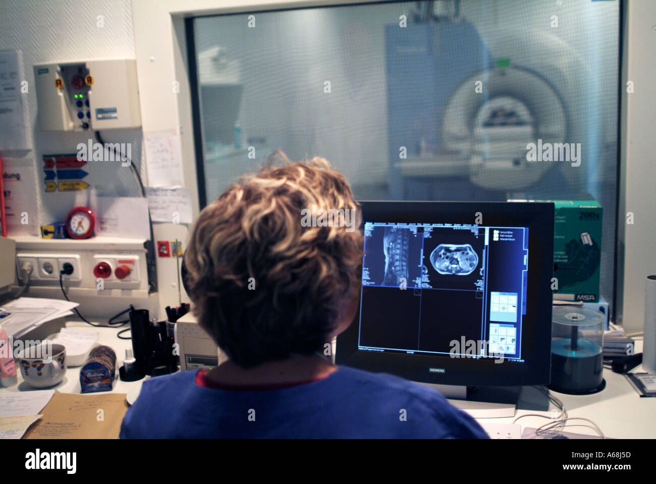 radiologist observing MRT scan results on a monitor Stock Photo - Alamy