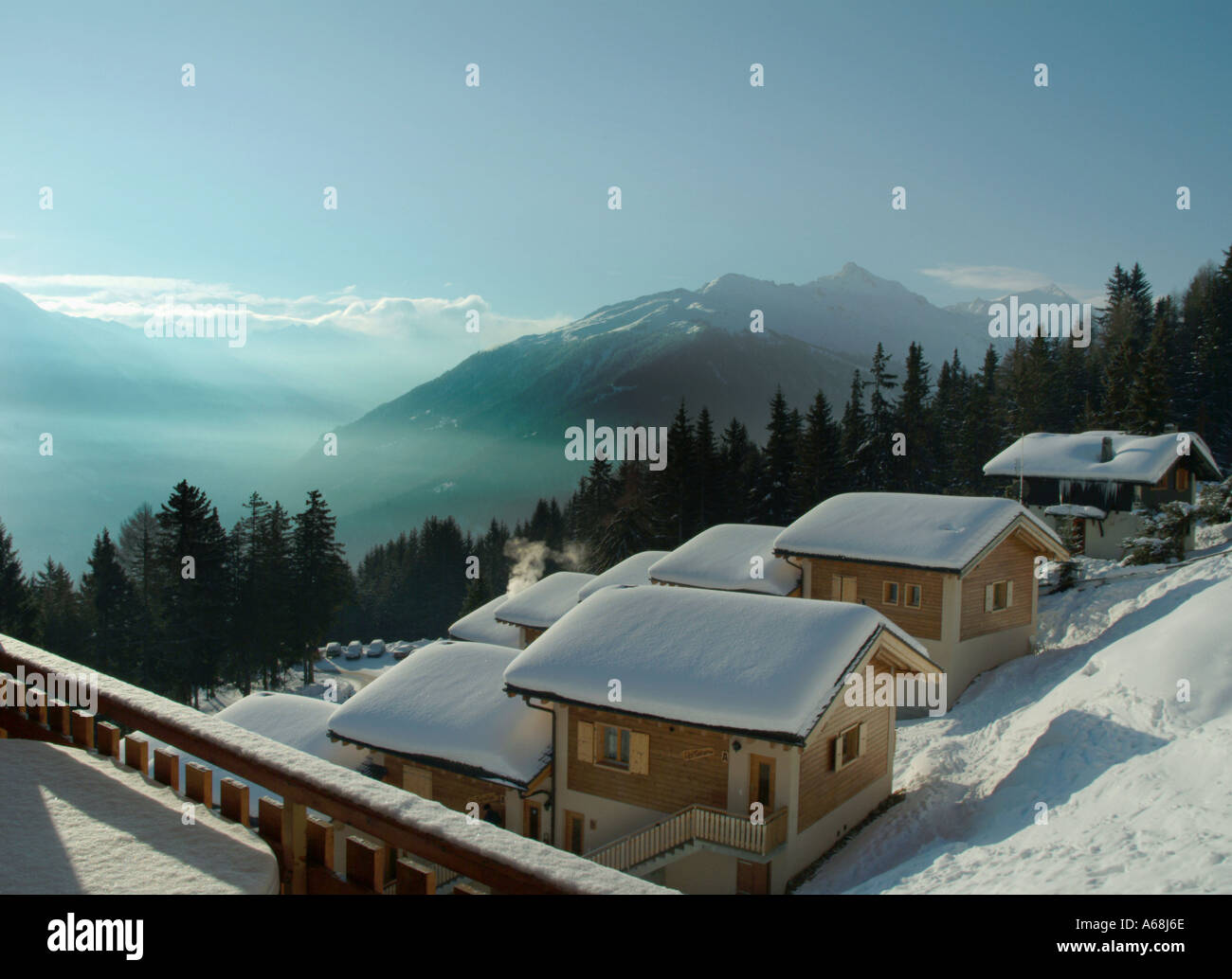 Les Collons swiss ski resort chalets at sunset with mountain matterhorn ...