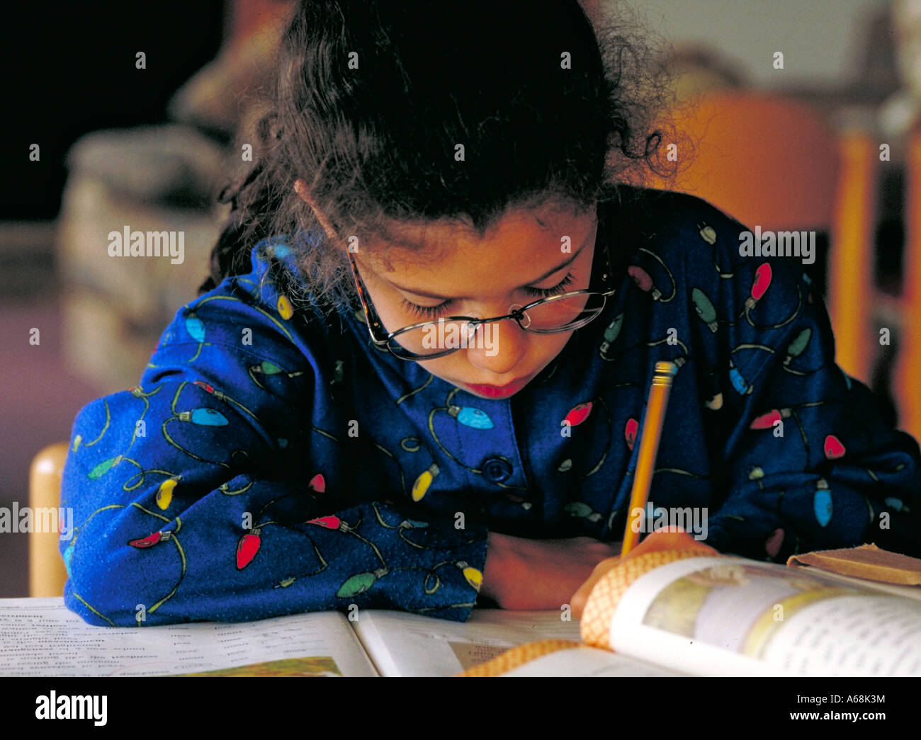 Girl doing homework Stock Photo - Alamy