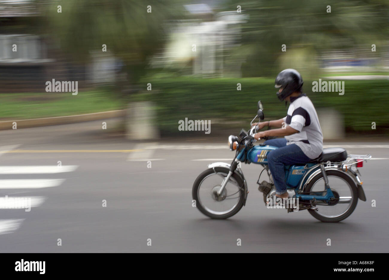 man riding a motorcycle Stock Photo - Alamy