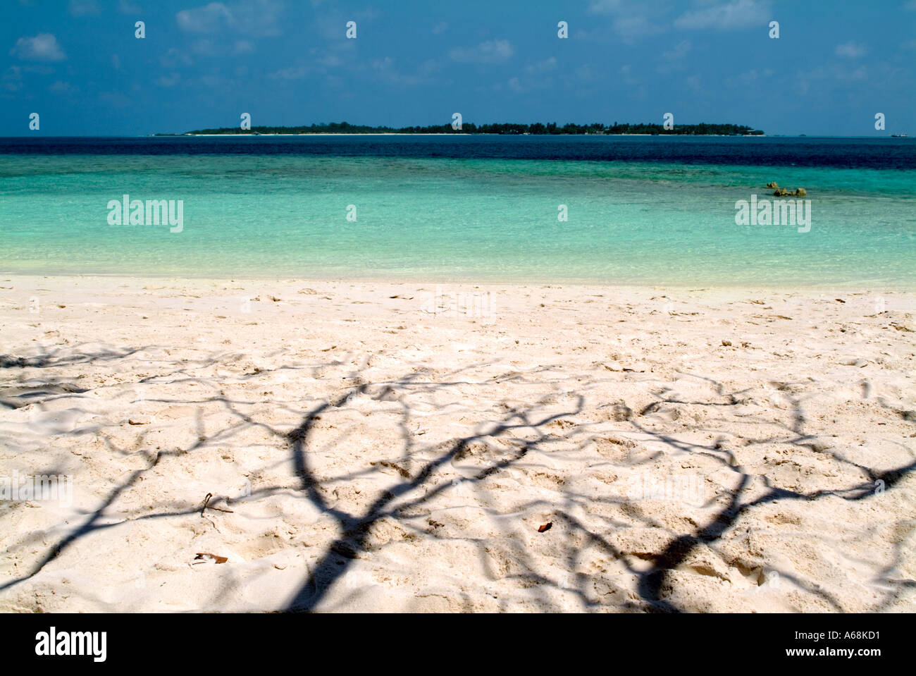 Shadows playing across the sand of a beach in the Maldives Stock Photo ...