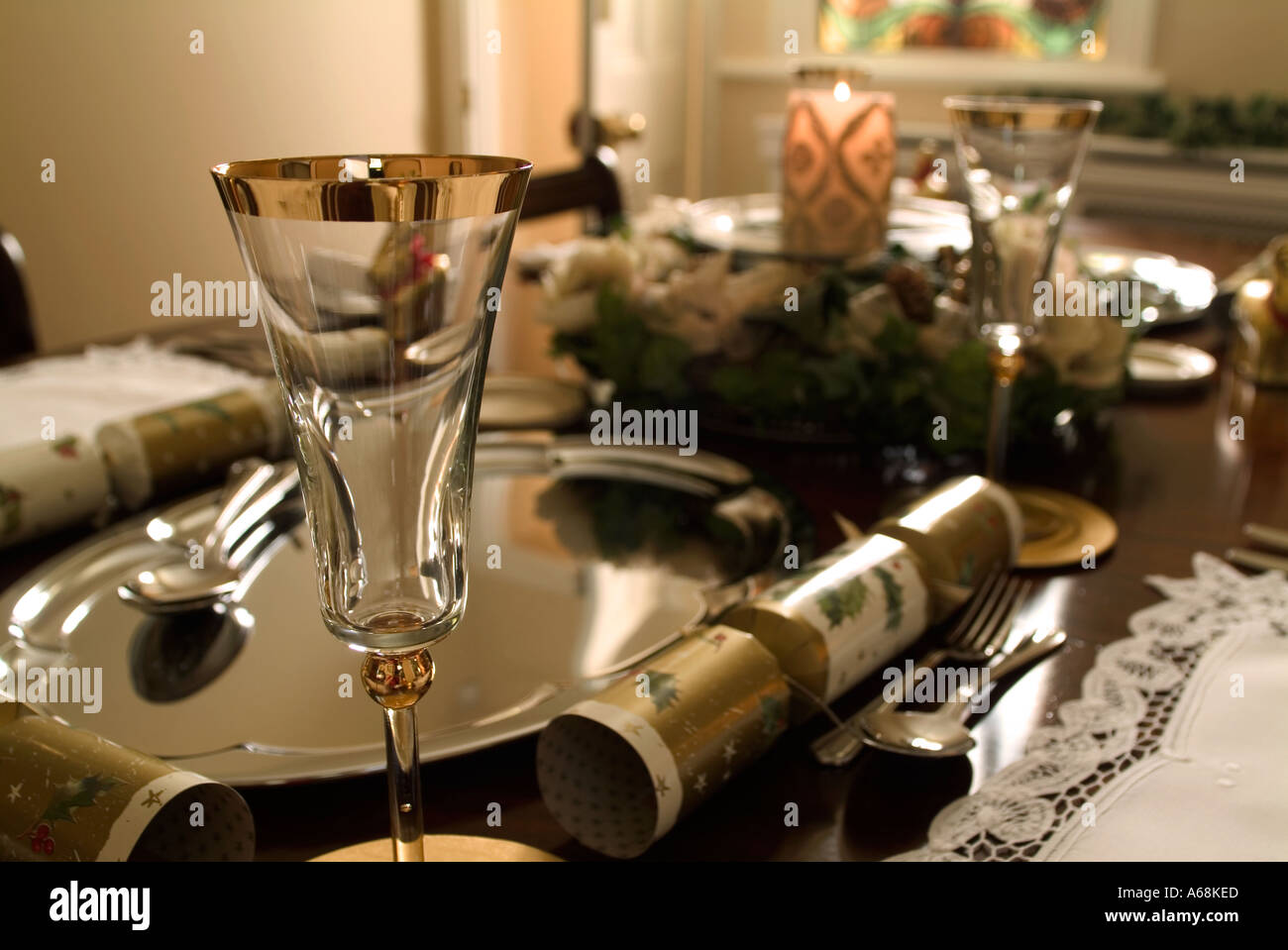 Christmas dinner table set with candle Stock Photo - Alamy