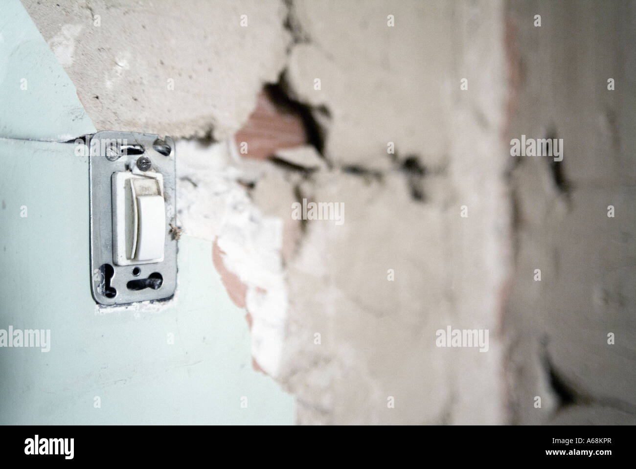 An electric switch on a destroyed wall Stock Photo - Alamy