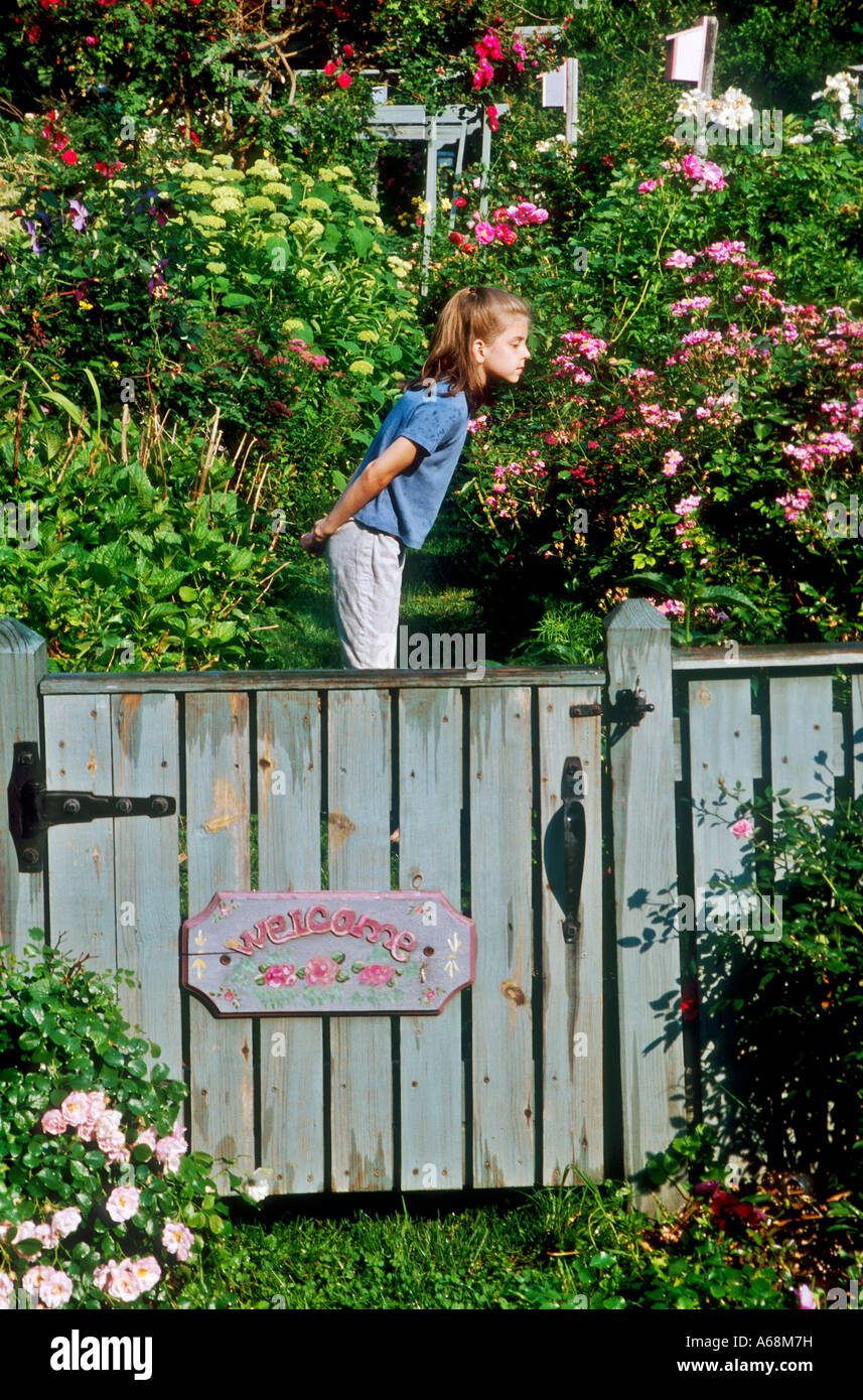 Child smelling roses hi-res stock photography and images - Alamy