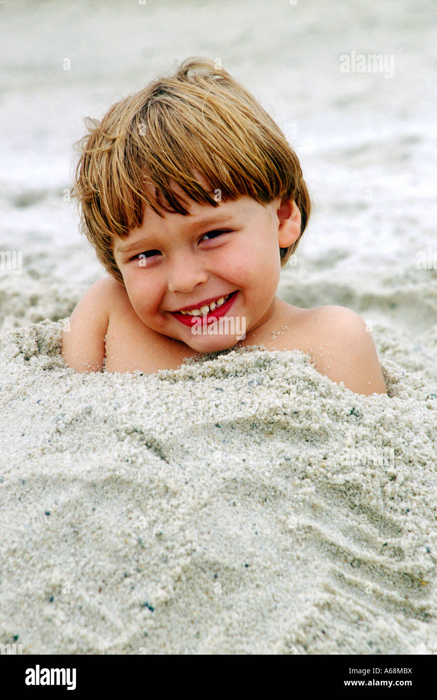 Kid sand buried hi-res stock photography and images - Alamy