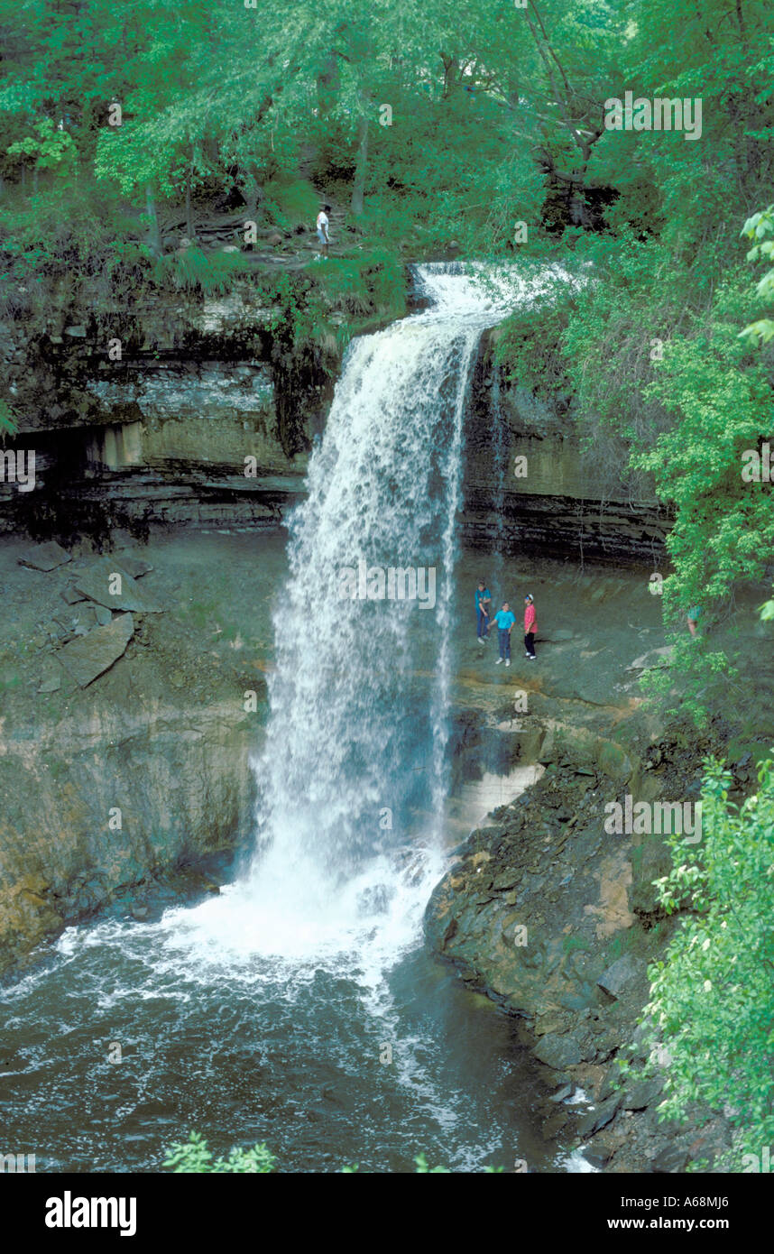 Hikers in back of Hidden Falls one of many waterfalls in the Twin ...