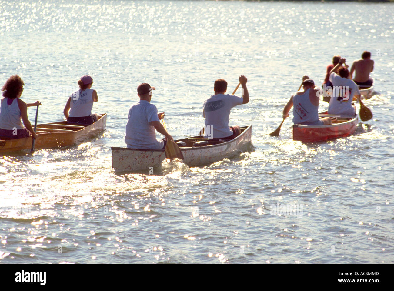 Canoers age 24 starting race paddling across Lake Nokomis. Courage ...