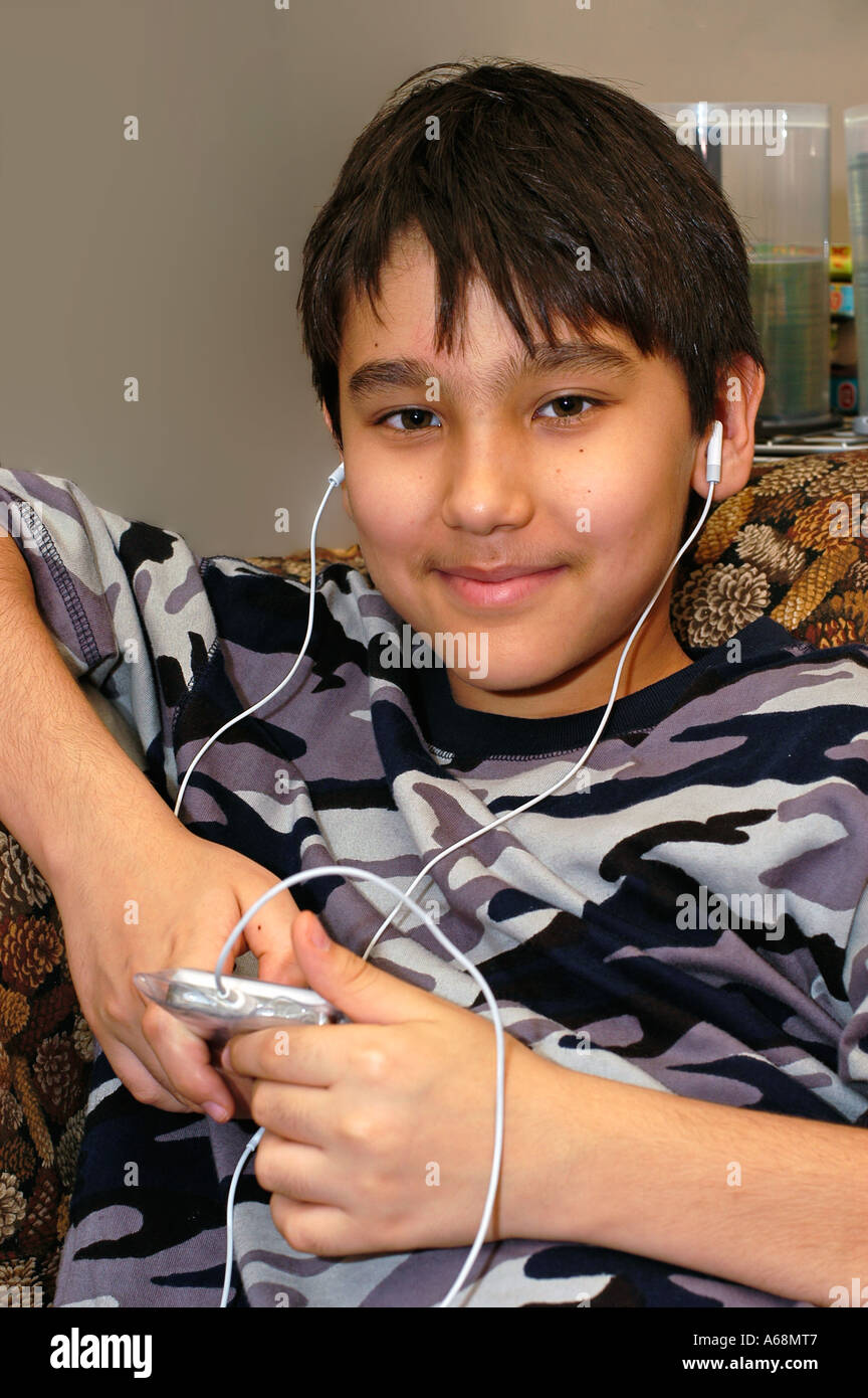 A boy listening to music Stock Photo - Alamy