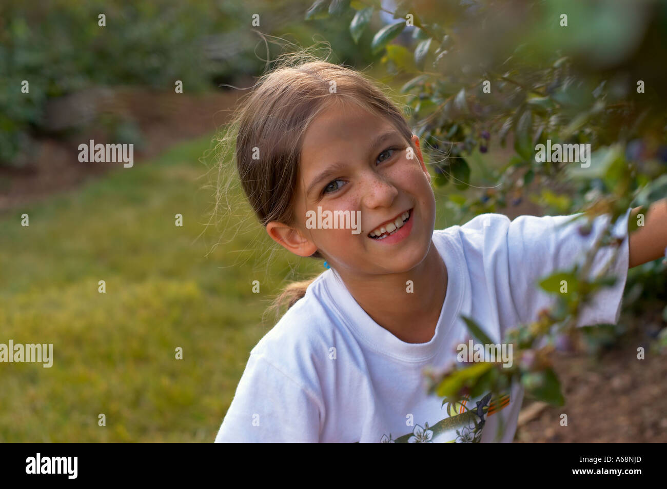 Portrait of a young girl in white t-shirt Stock Photo - Alamy