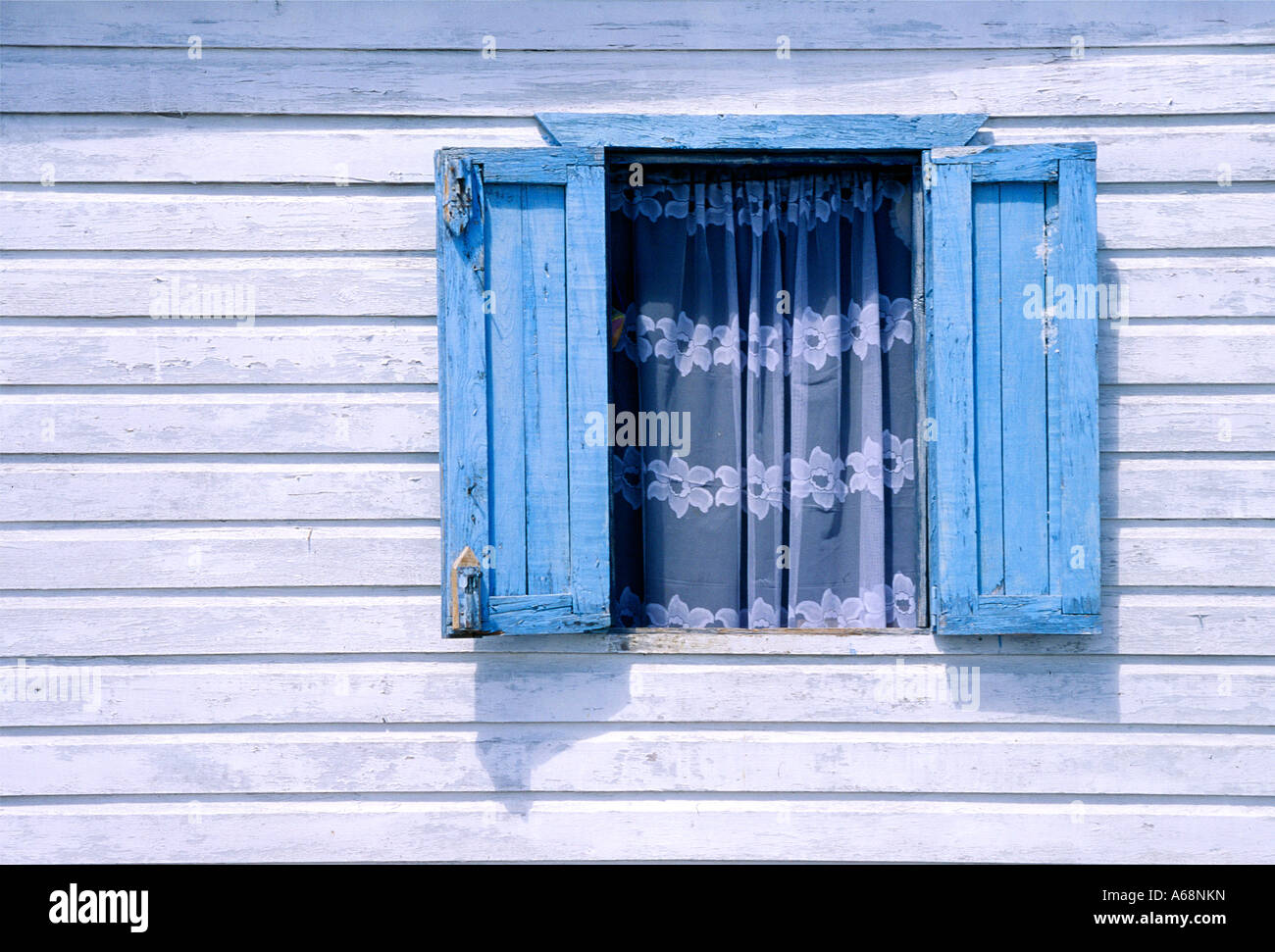 Blue window white lace Ambergris Caye Belize Stock Photo - Alamy