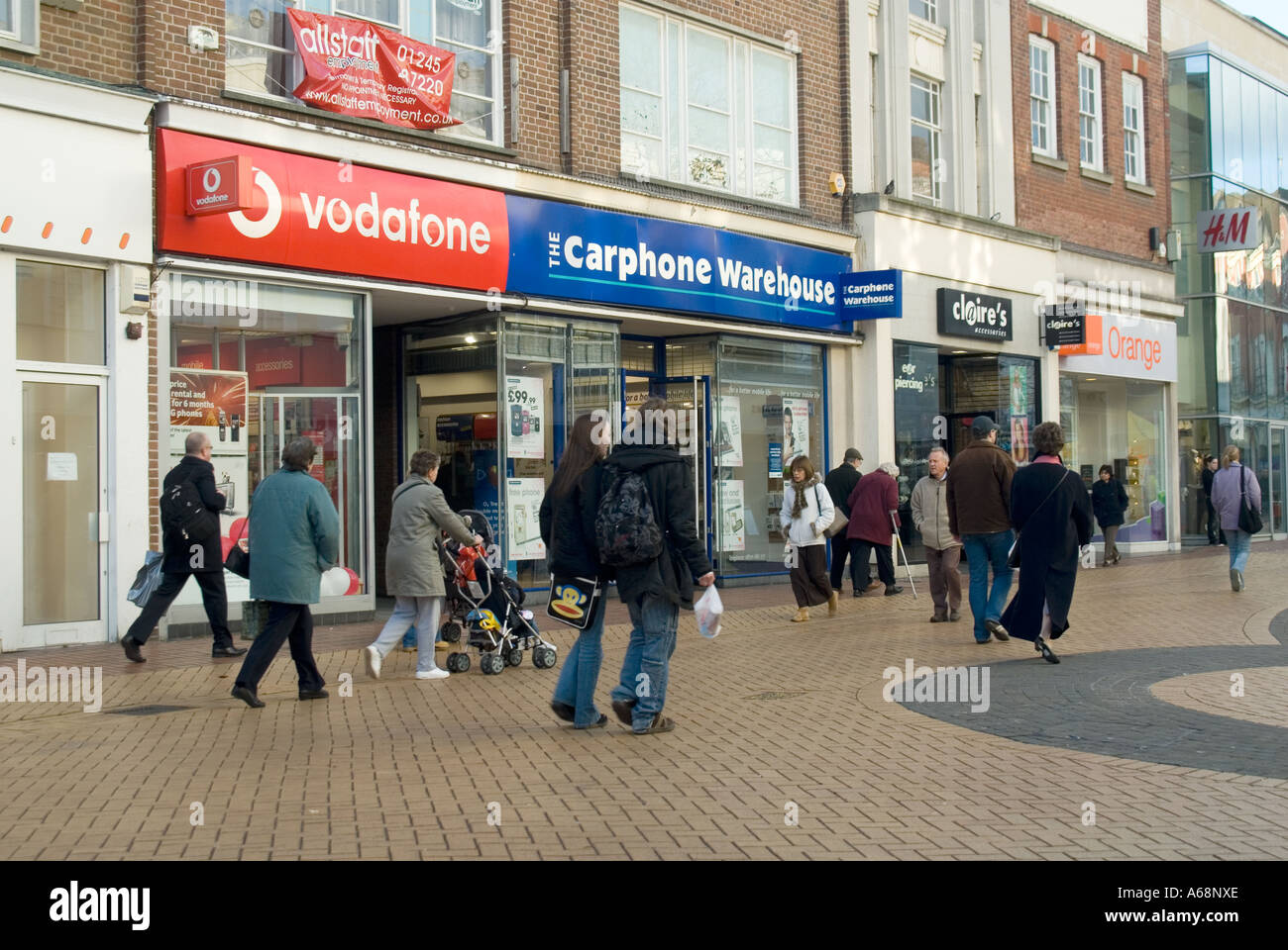 Three mobile phone shops close together in pedestrianised shopping High ...