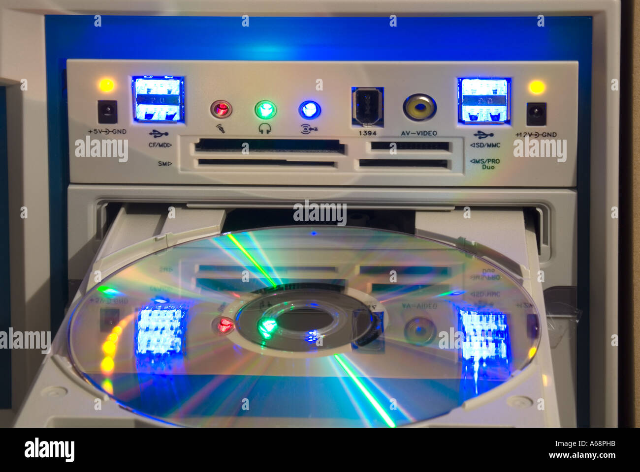 Personnel Computer CD in drive tray reflecting lights from USB and card ...